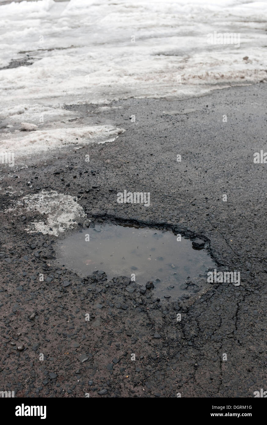 Frost damage, potholes in the road surface, Germany Stock Photo - Alamy