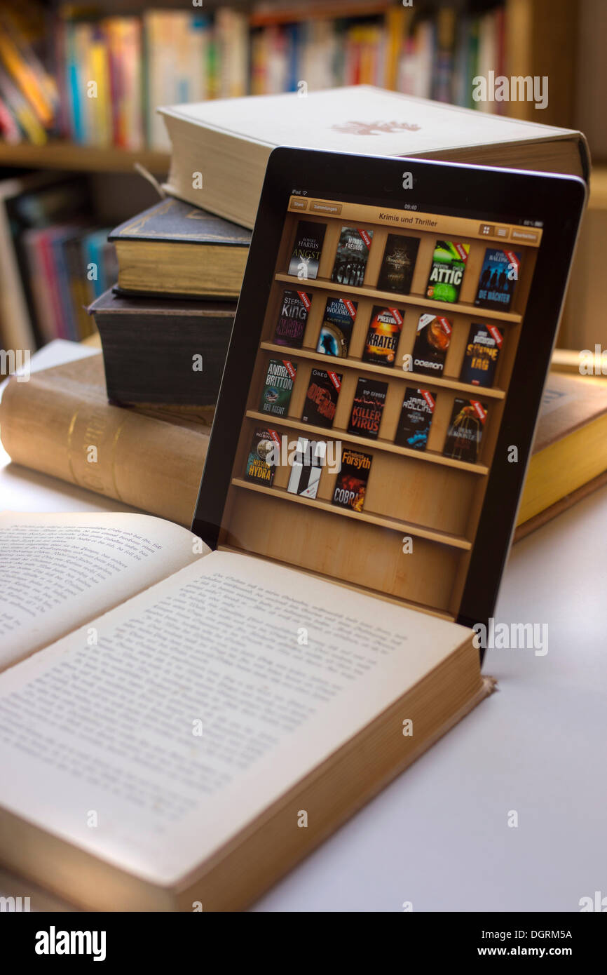 E-book reader beside a stack of old books, Germany Stock Photo - Alamy