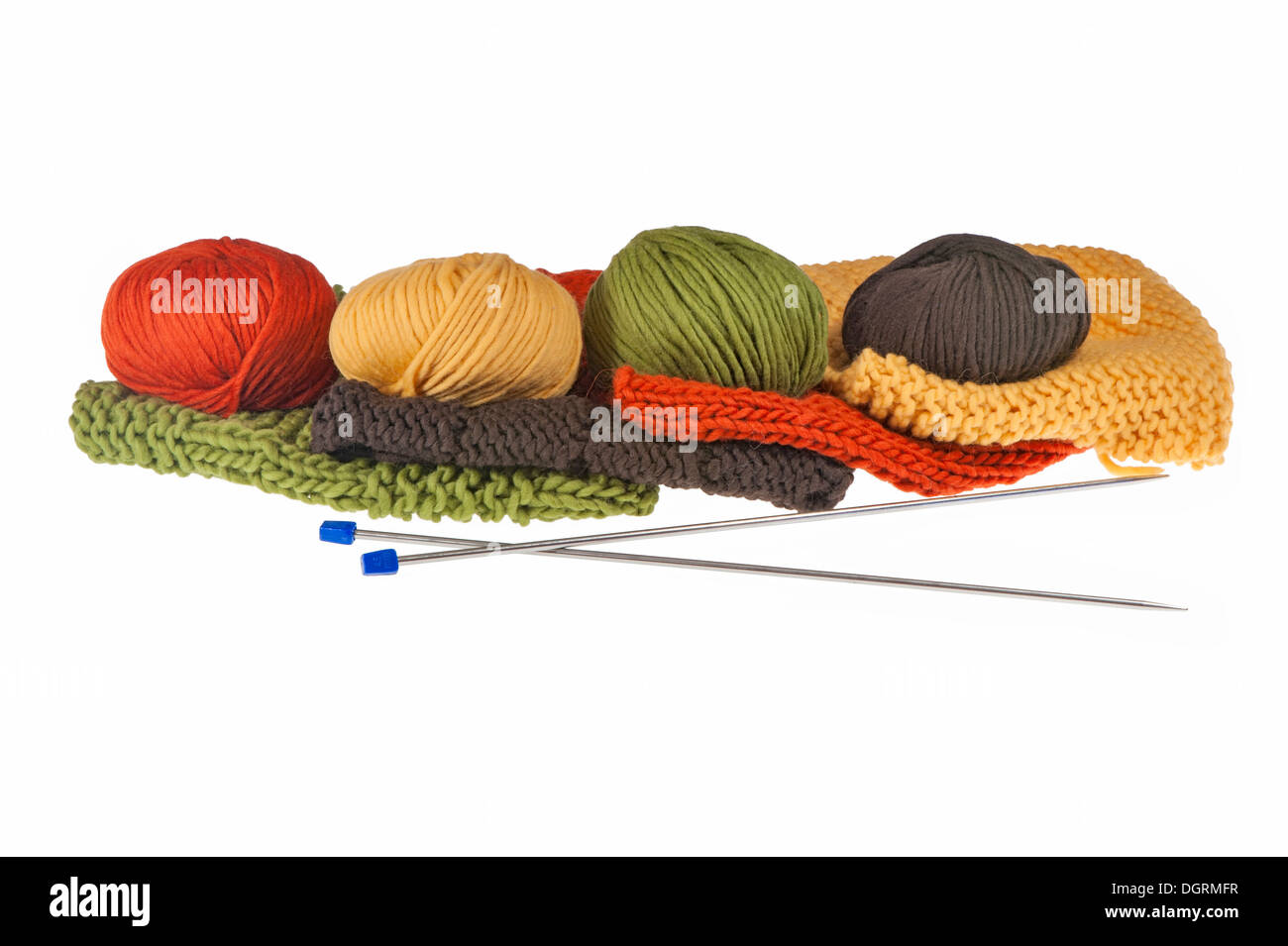 Three wool balls in white background with needles Stock Photo - Alamy