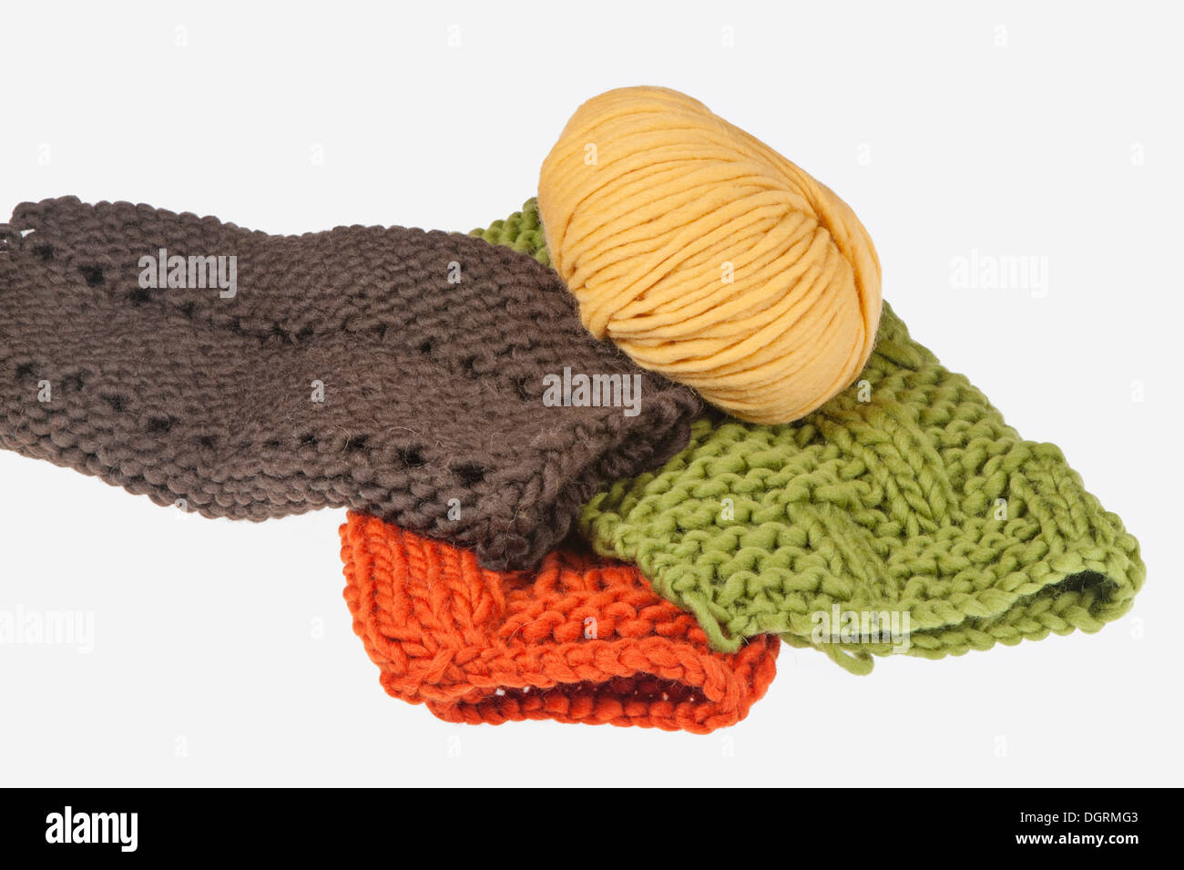 Three wool balls in white background with needles Stock Photo - Alamy