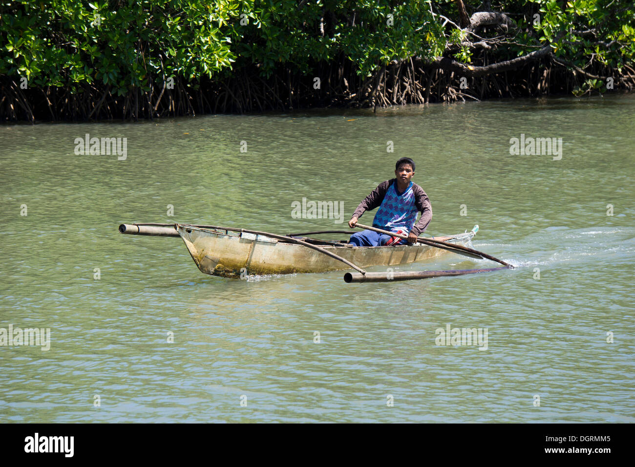 Banka, traditional Philippine outrigger boat, on the Decalachao river ...