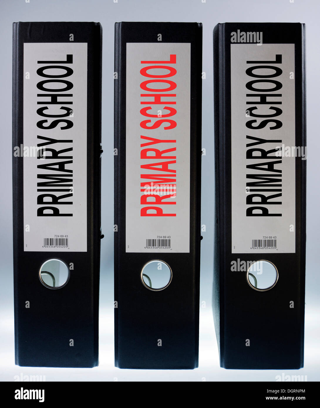 Three file folders labeled "Primary School Stock Photo - Alamy