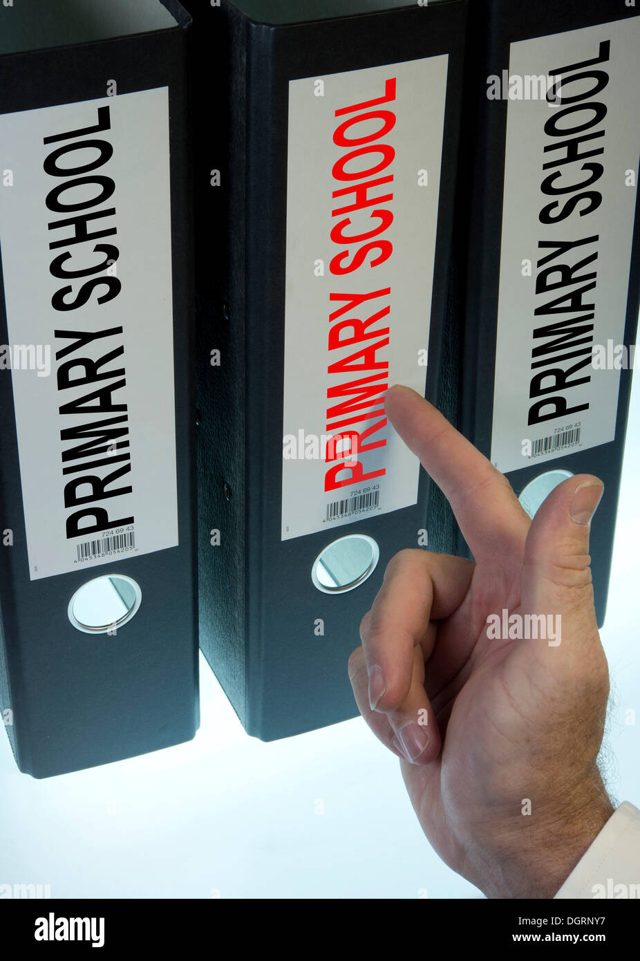Hand pointing to a file folder labeled "Primary School" Stock Photo - Alamy