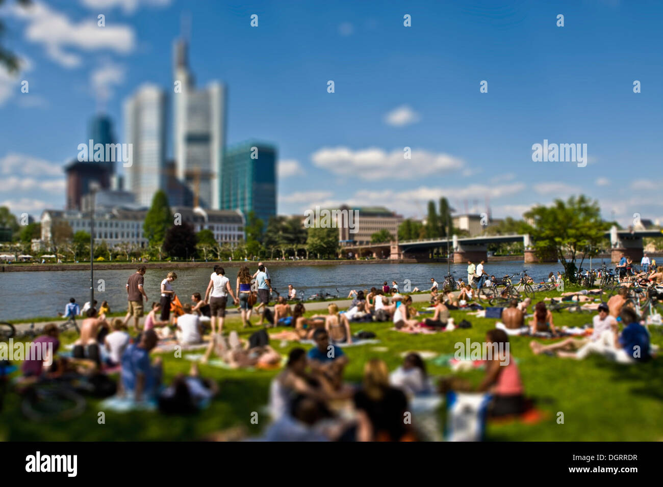 Young people on the Main river, behind the Financial District ...