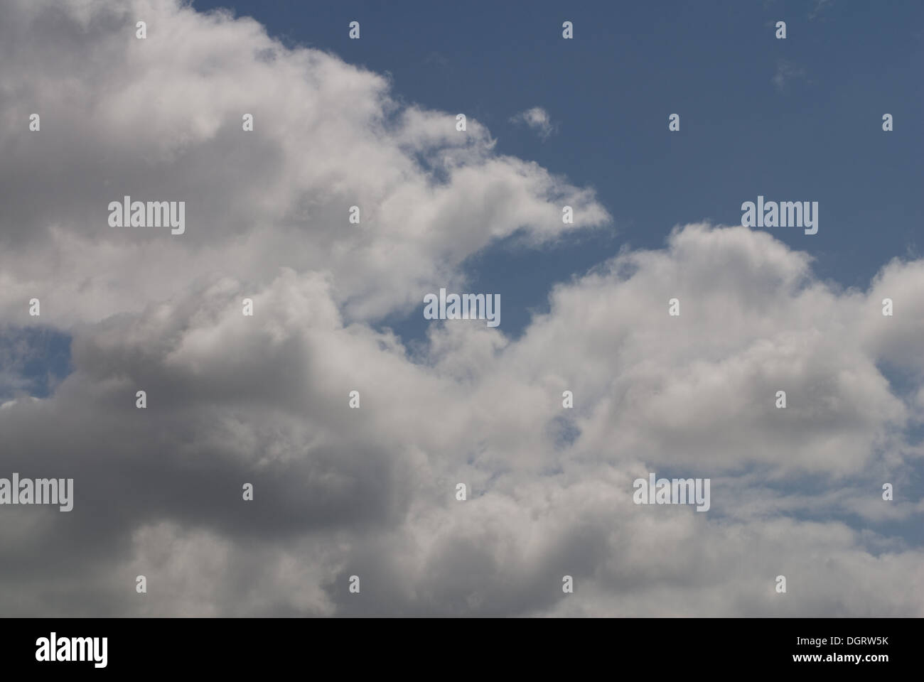 Blue sky and building storm clouds Stock Photo - Alamy