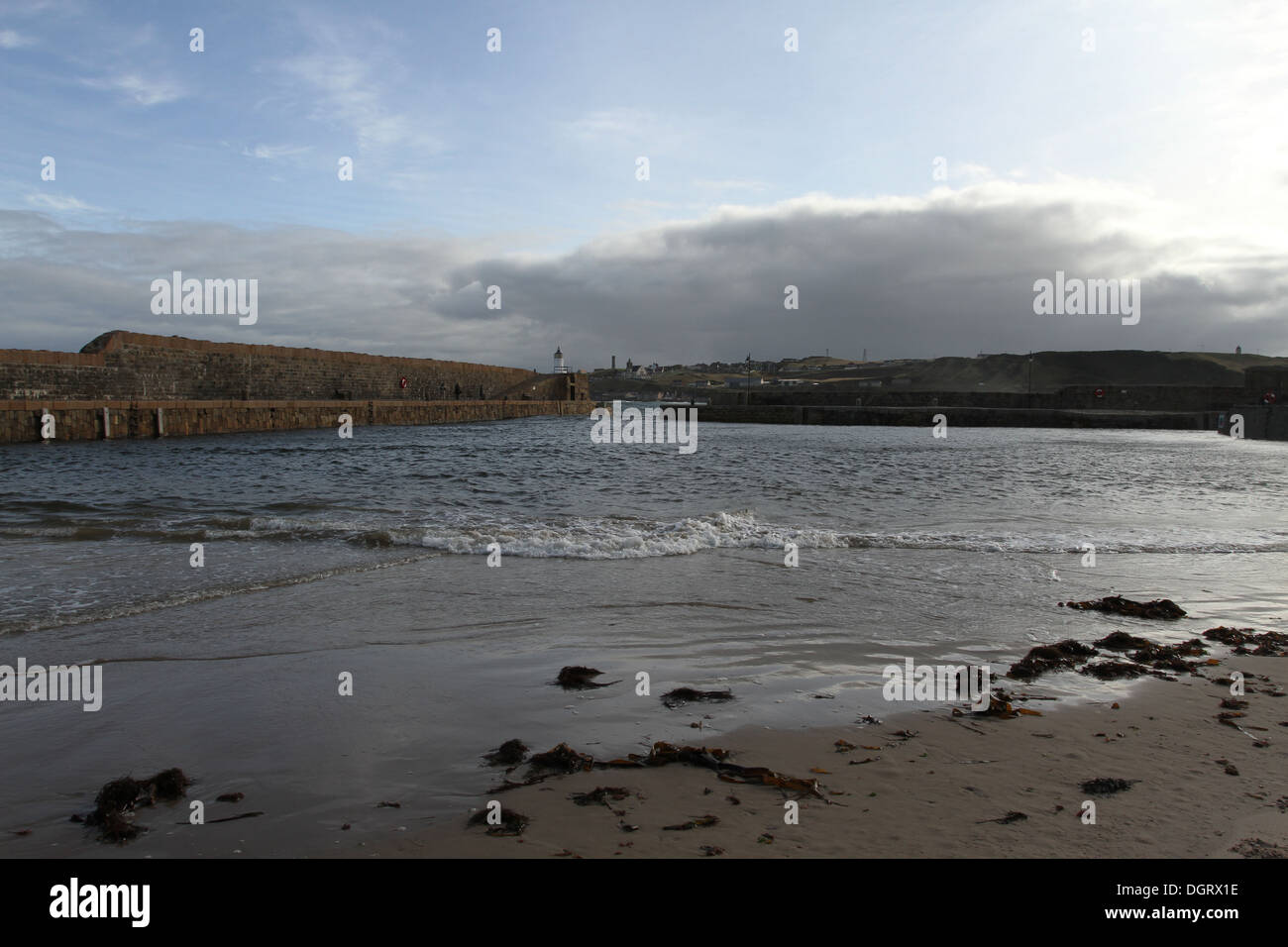 Entrance to Banff harbour with Macduff waterfront Scotland October 2013 ...