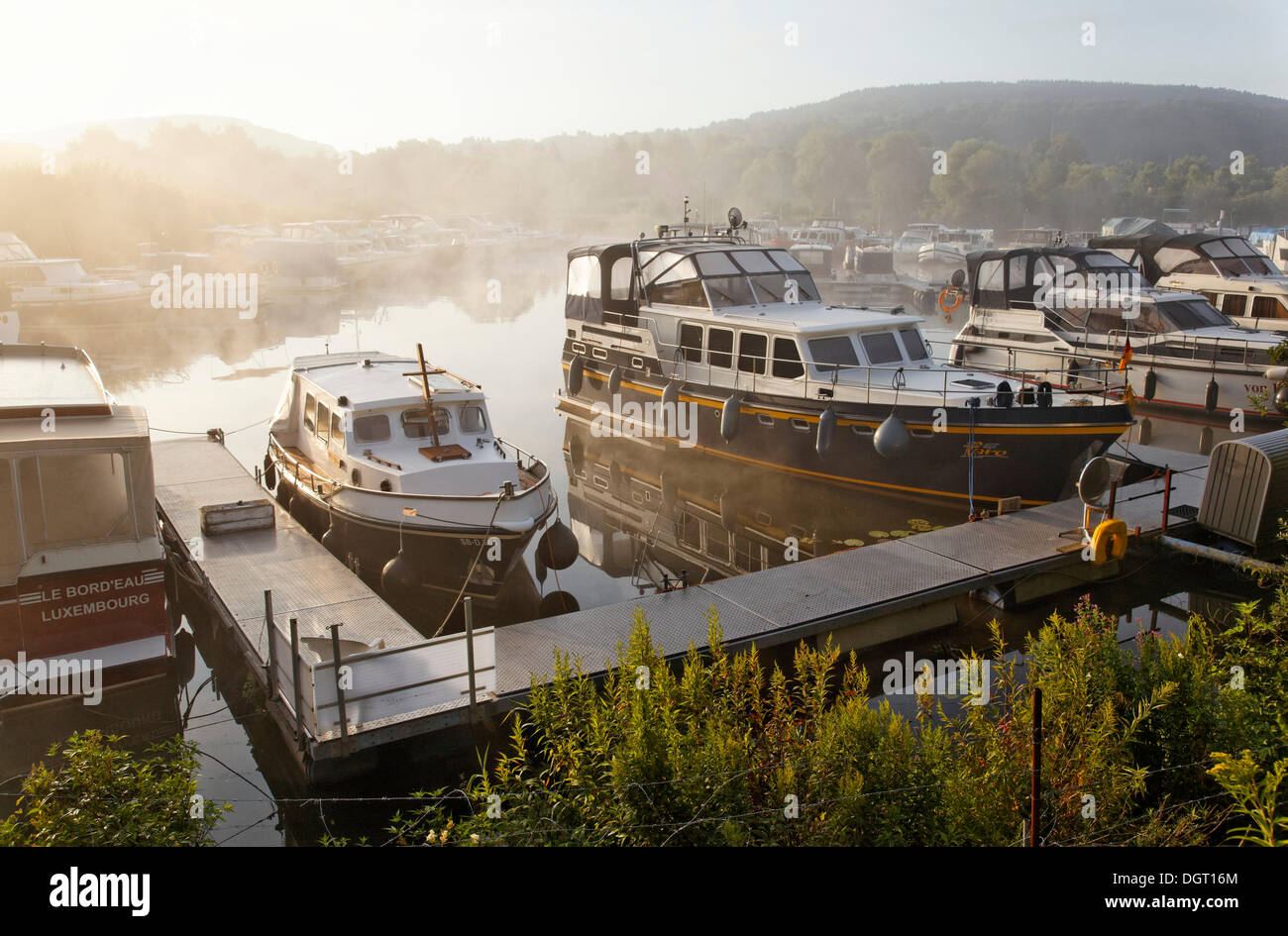 Houseboats on the Saar river, Merzig Marina in the morning mist ...