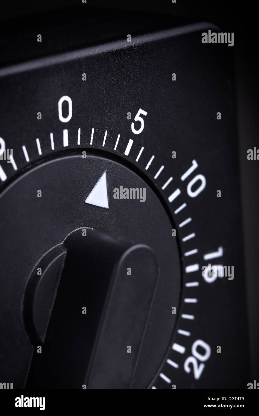 black egg timer with a reflection on grey background Stock Photo - Alamy
