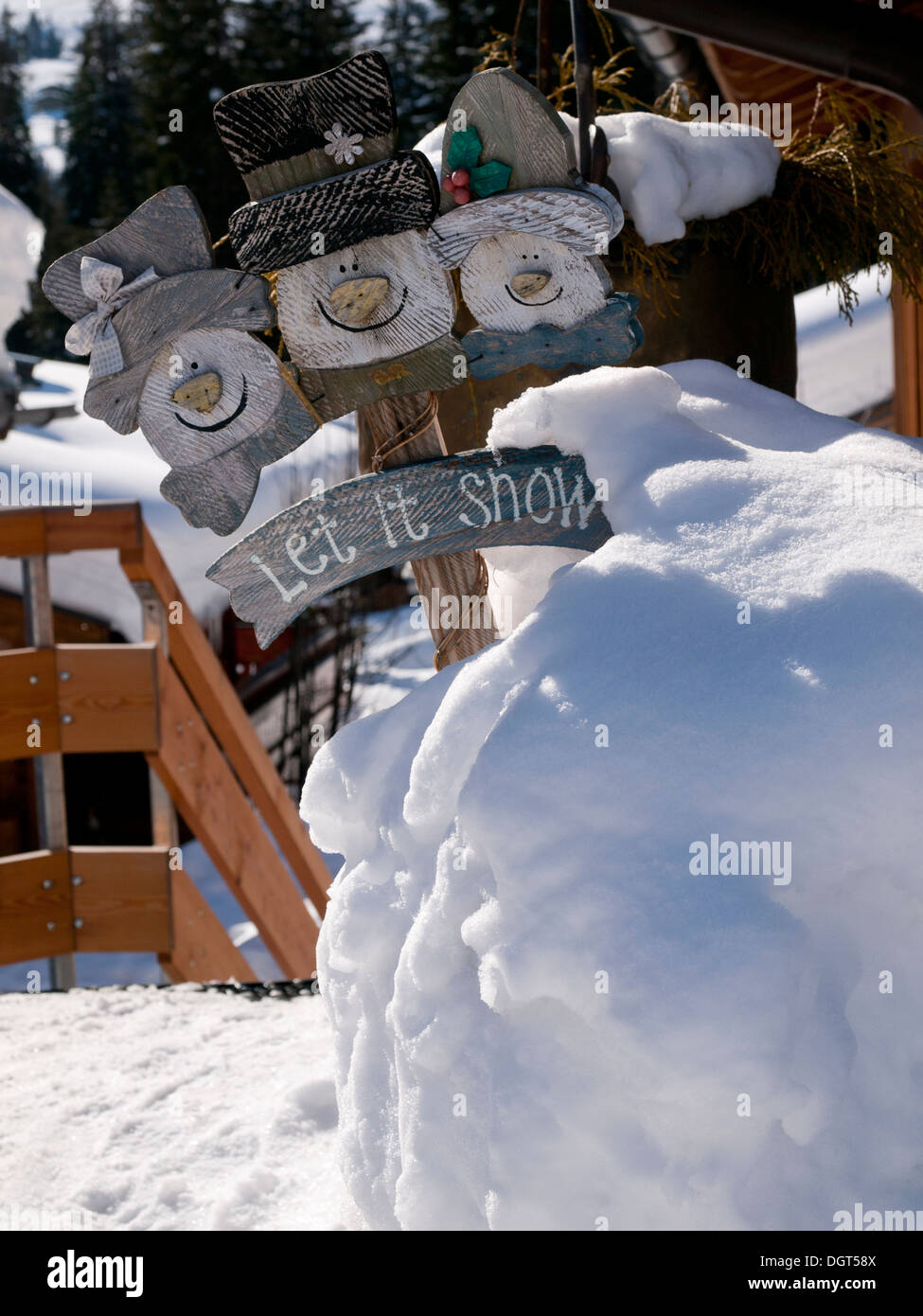 Cute snowmen "let it snow" sign in a big pile of snow Stock Photo - Alamy
