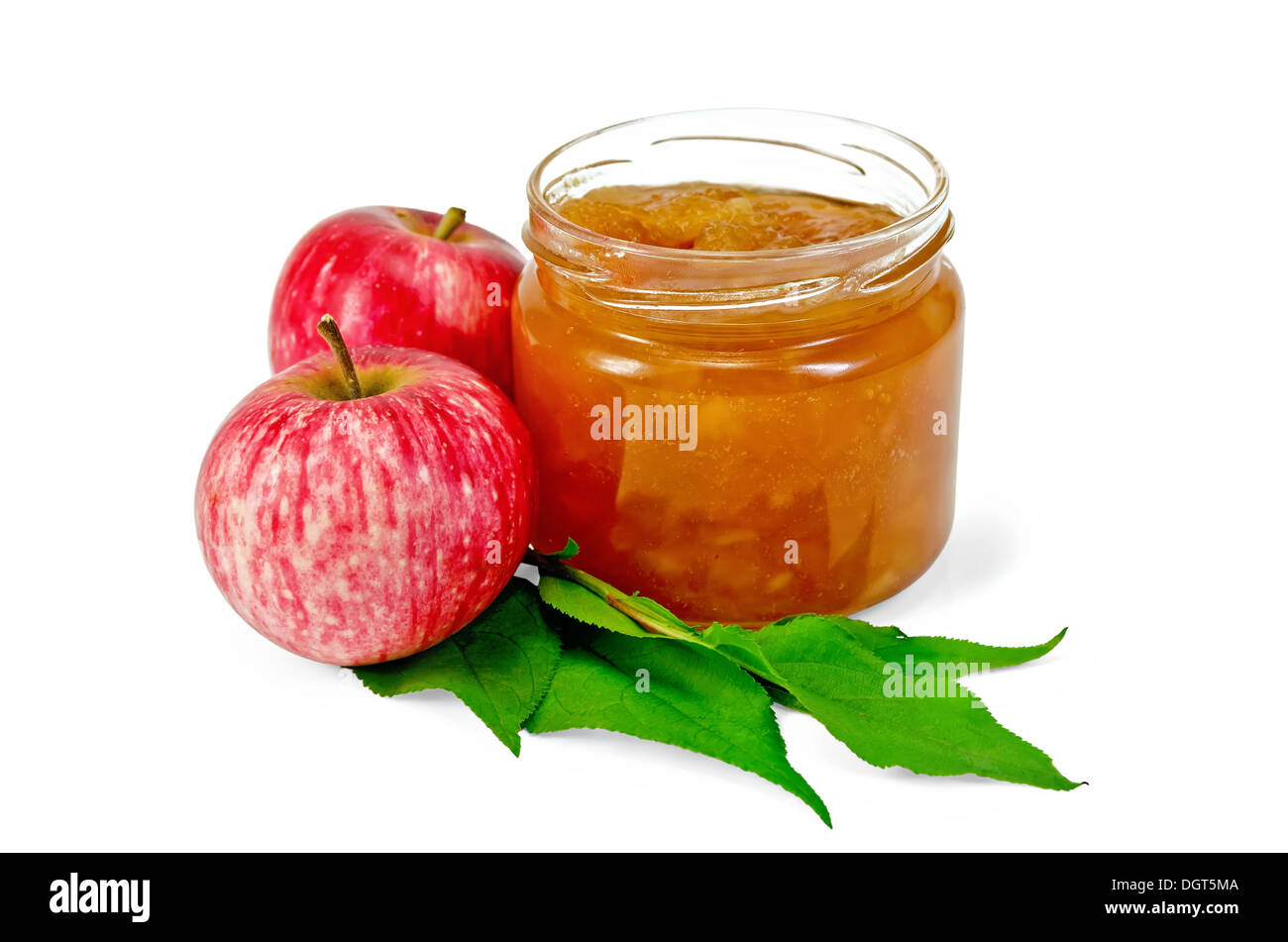 Apple jam in a glass jar, fresh red apples, twigs and leaves isolated ...