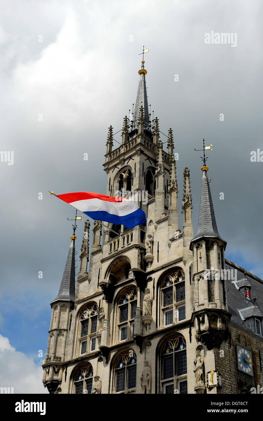 Stadhuis Gothic city hall at the market, national flag marking a public ...