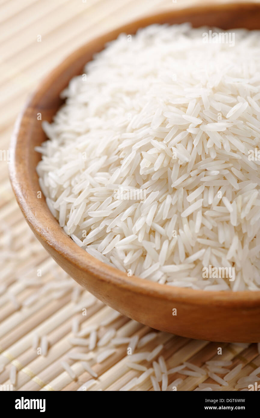 Wooden bowl full of basmati rice Stock Photo - Alamy