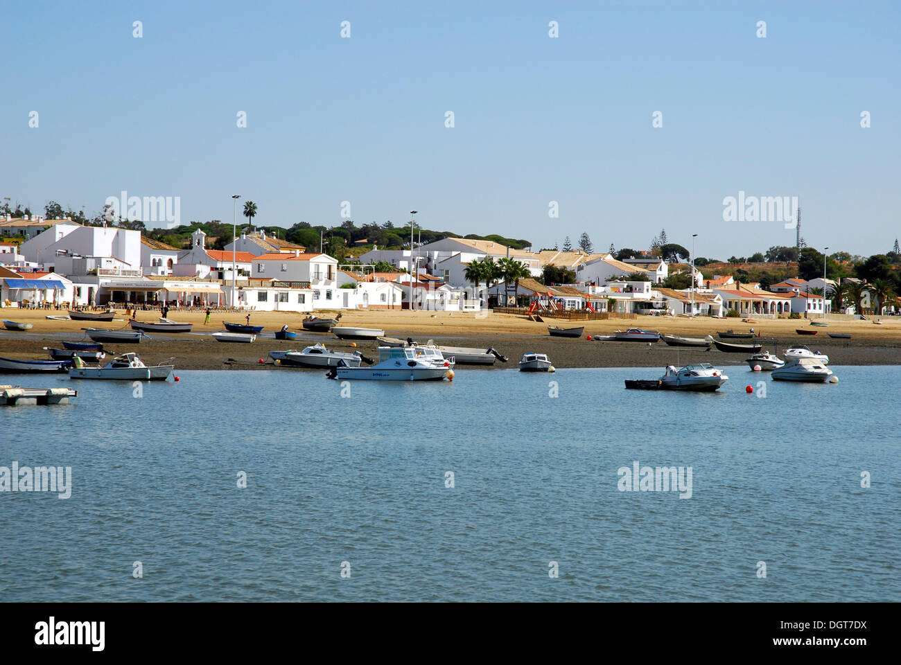 Boats on the Rio Piedras river, ebb tide at the beach in El Rompido ...