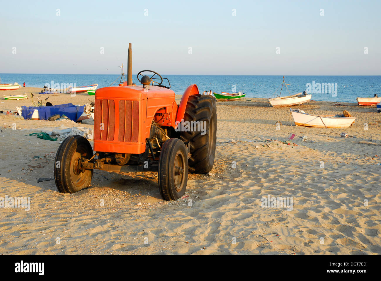 Beach of the Atlantic Ocean, tractor and boats, fishing village La ...