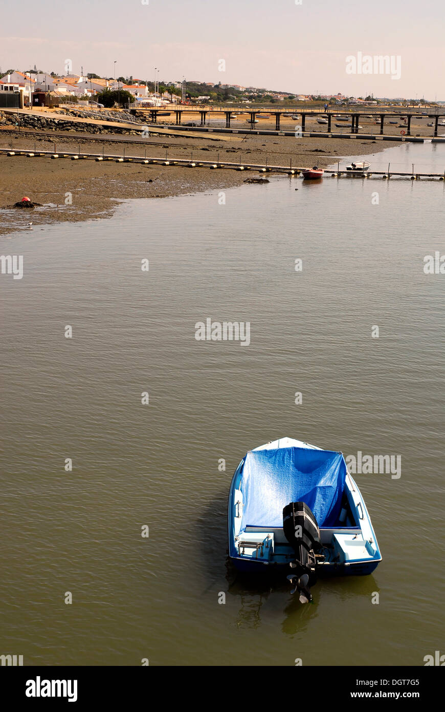 Boat at the Rio Piedras river, low tide at the beach in El Rompido ...
