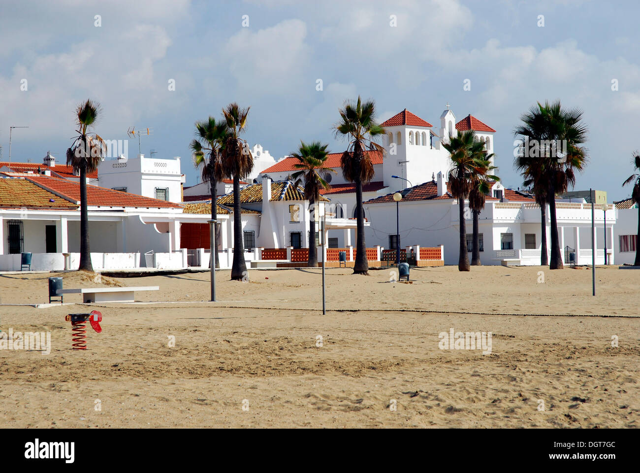 Promenade with church and palm trees on the beach, La Antilla, Lepe ...