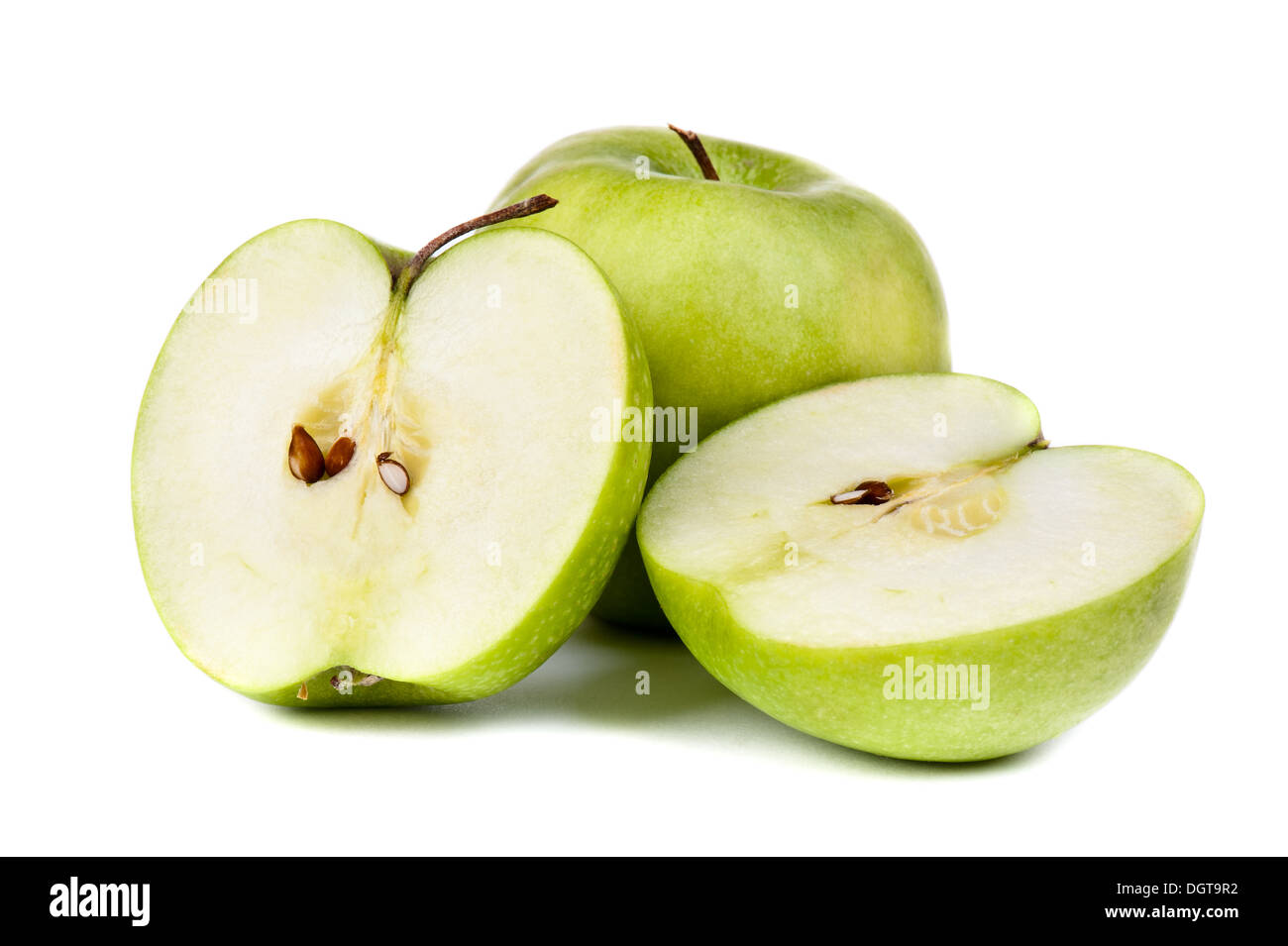 Whole and cut open green apple on white background Stock Photo - Alamy