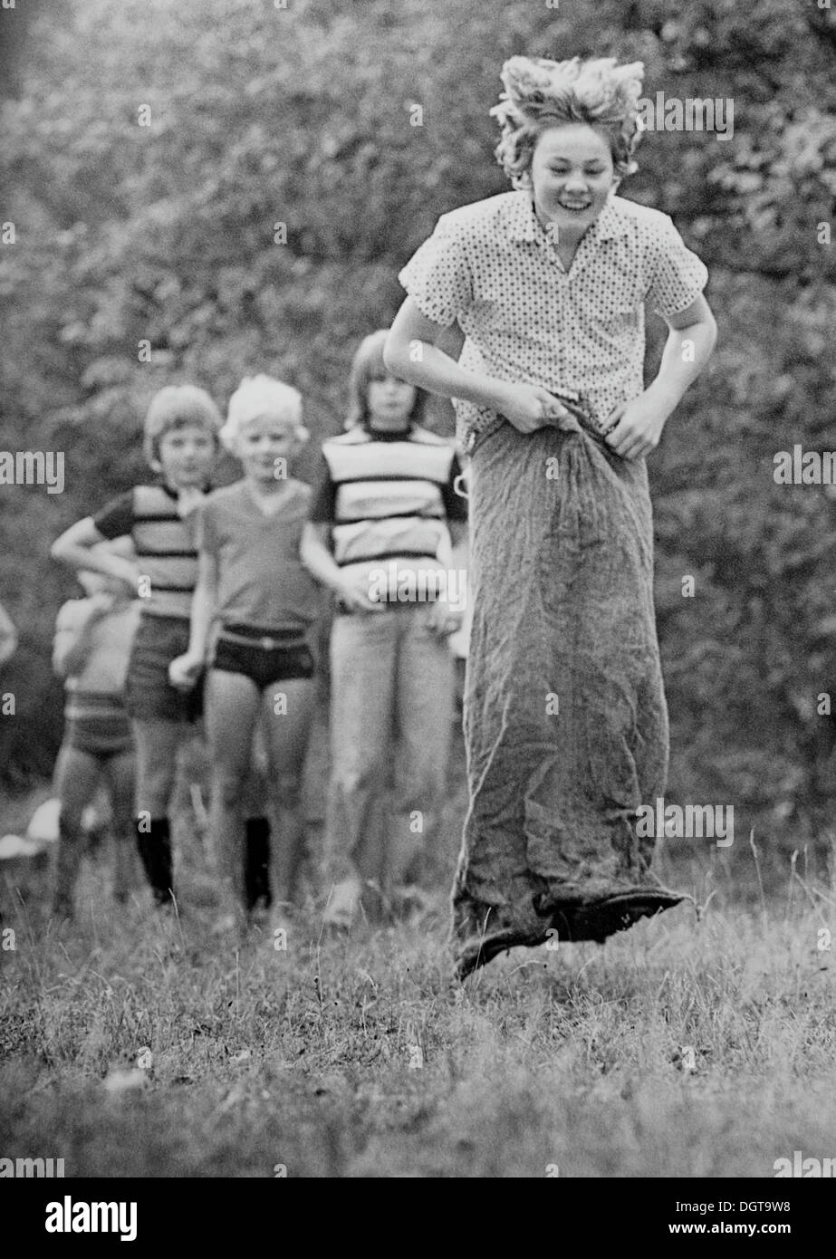 Children in a sack race, East Germany, around 1976 Stock Photo - Alamy