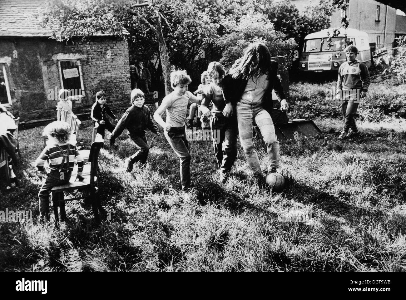 Children and young man playing soccer, East Germany, around 1986 Stock ...