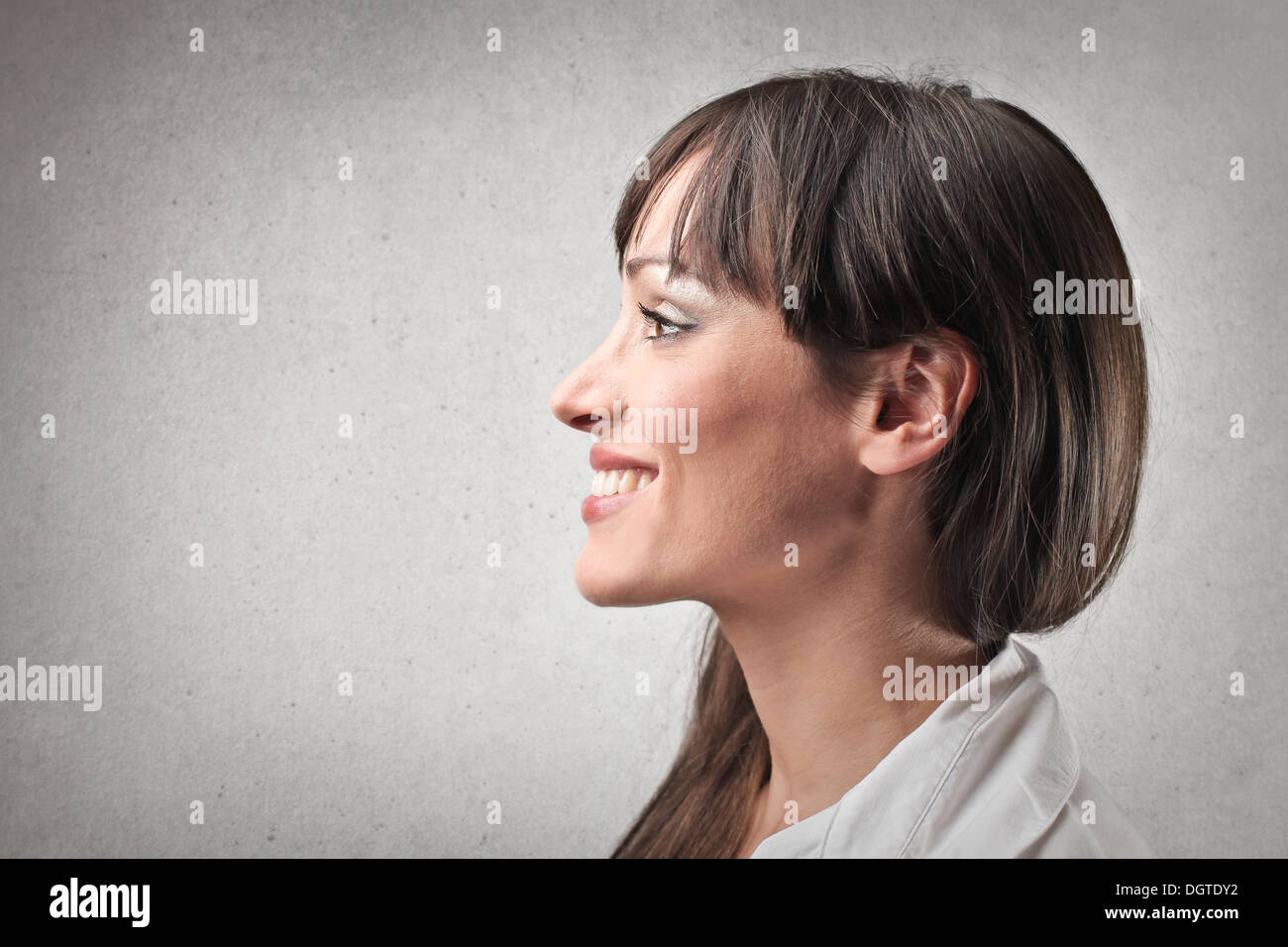 Profile of a brown woman smiling Stock Photo - Alamy
