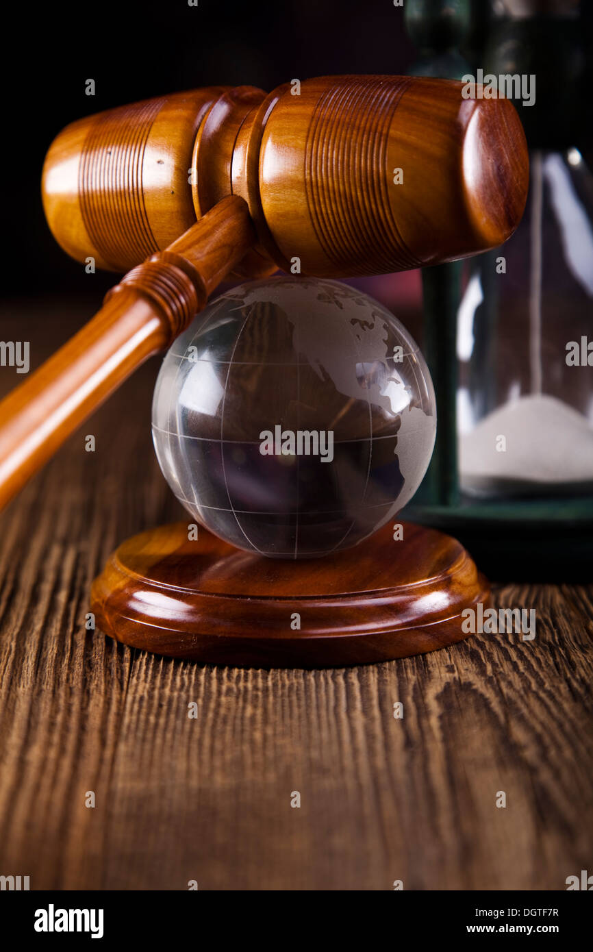 Wooden gavel and glass globe Stock Photo - Alamy
