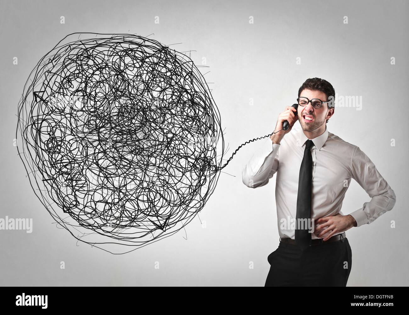 Office worker using a telephone with the wire very tangled Stock Photo ...