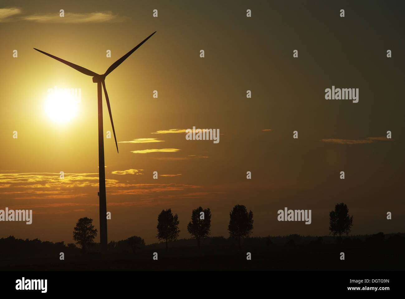 wind turbine on sunset background Stock Photo - Alamy