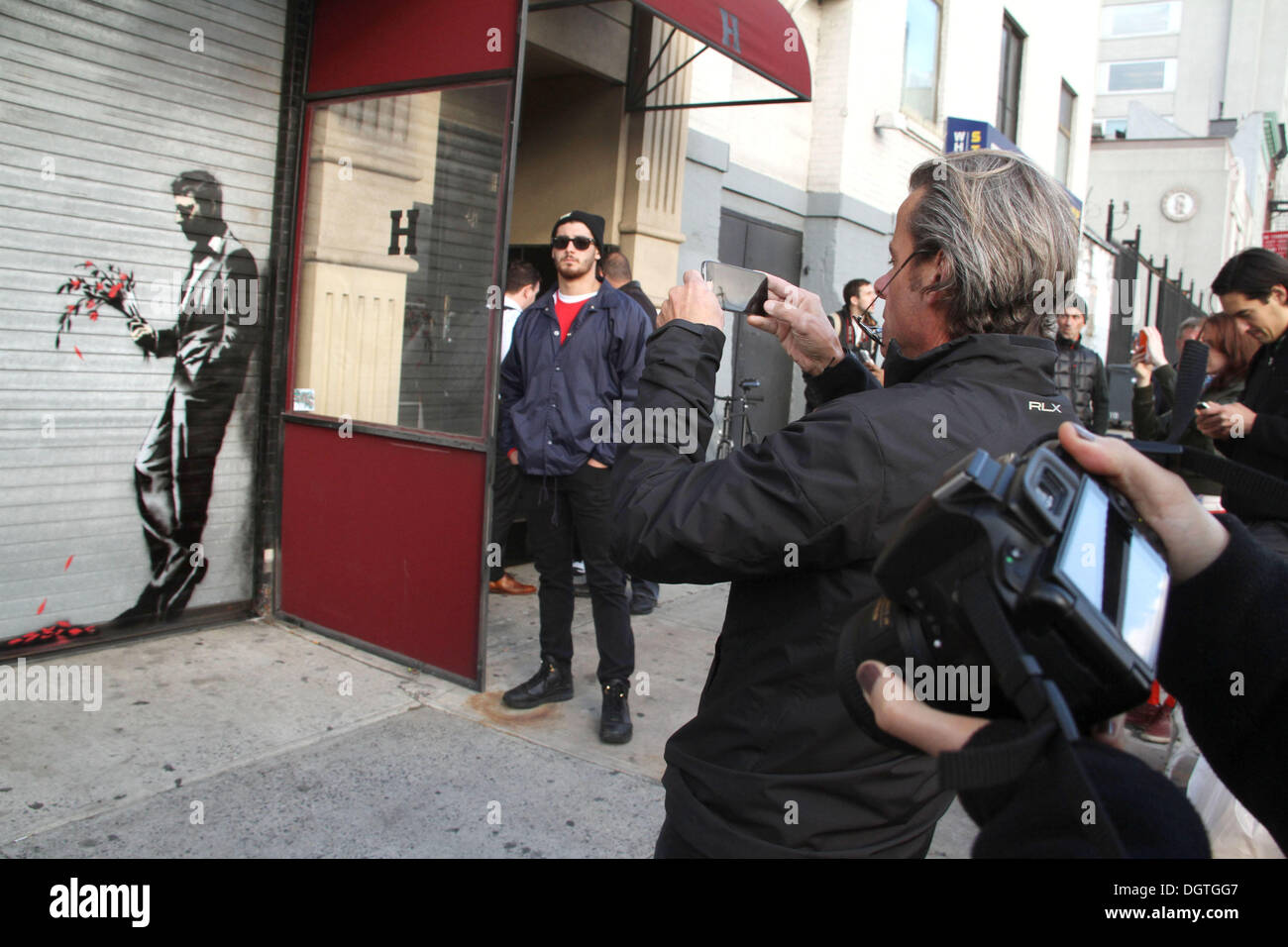 New York, New York, USA. 24th Oct, 2013. A security guard watches as ...