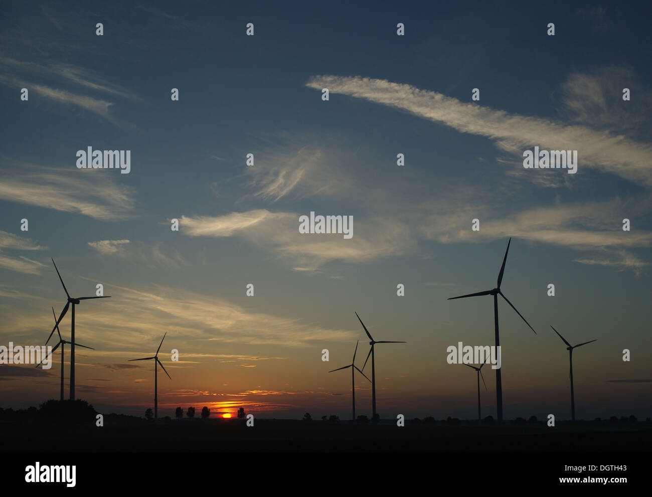 wind turbine on sunset background Stock Photo - Alamy