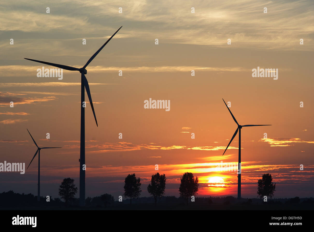 wind turbine on sunset background Stock Photo - Alamy
