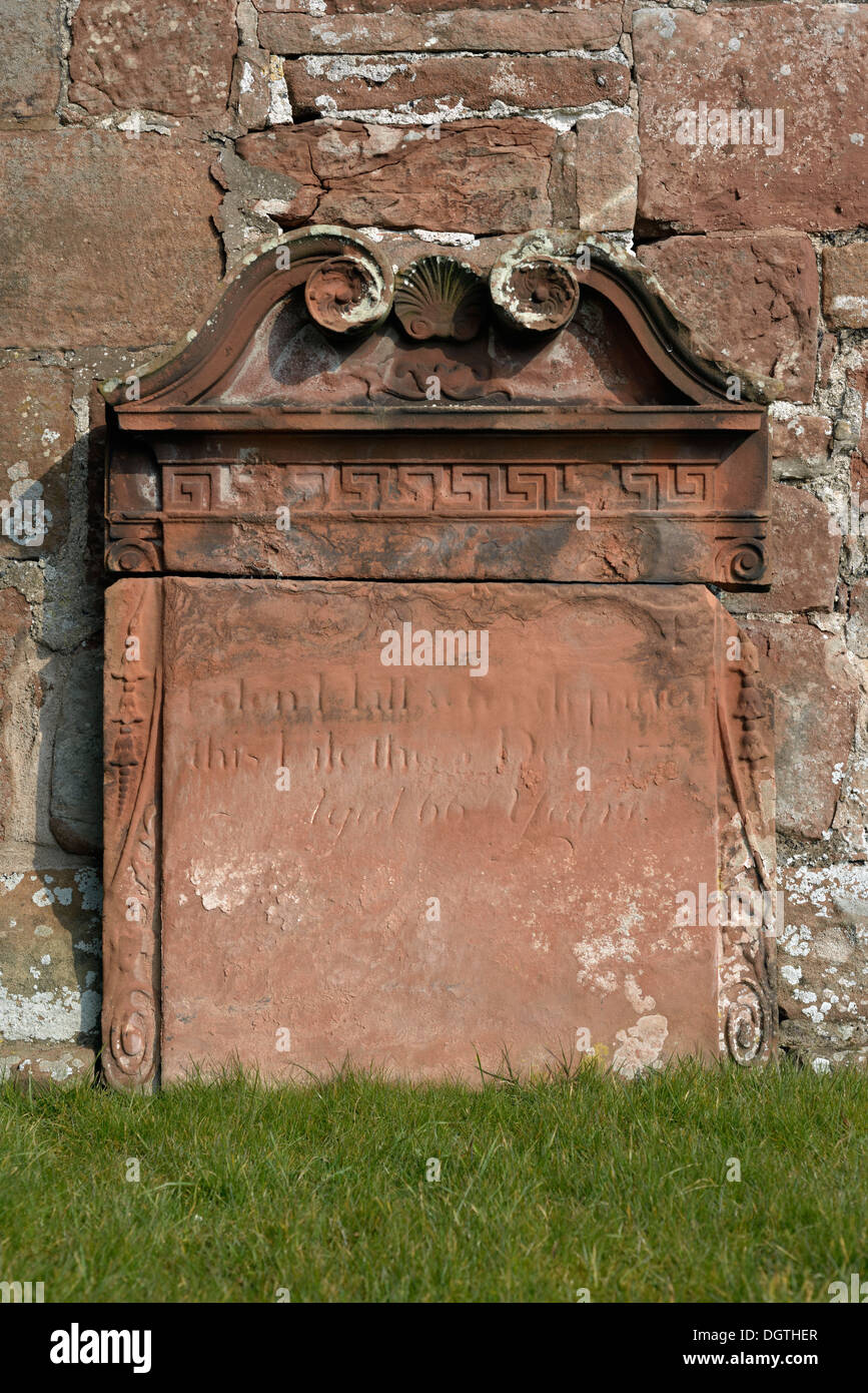 Badly eroded sandstone gravestone. Church of Saint Cuthbert. Edenhall ...