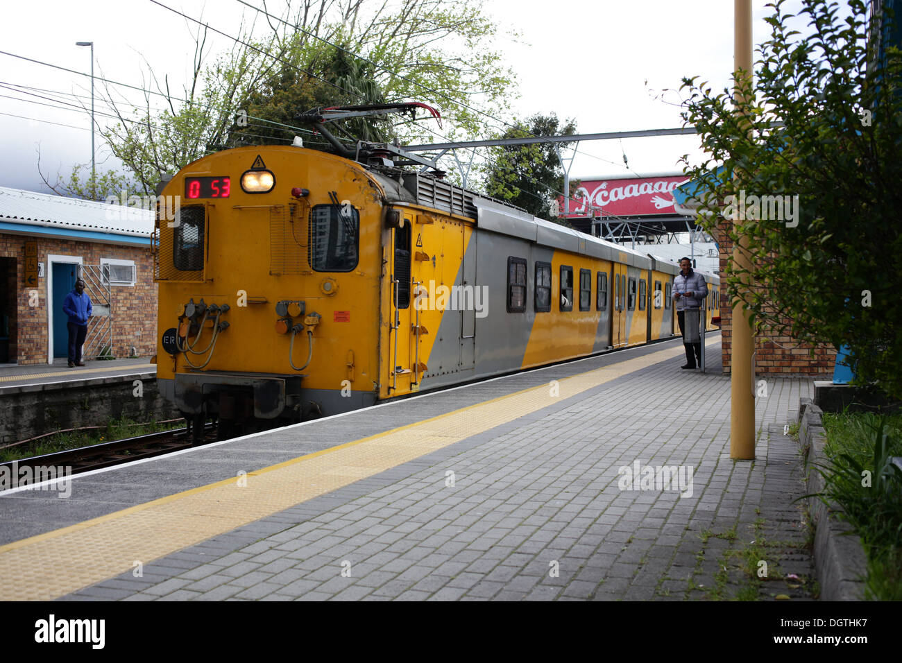 Train arriving at station platform Stock Photo - Alamy