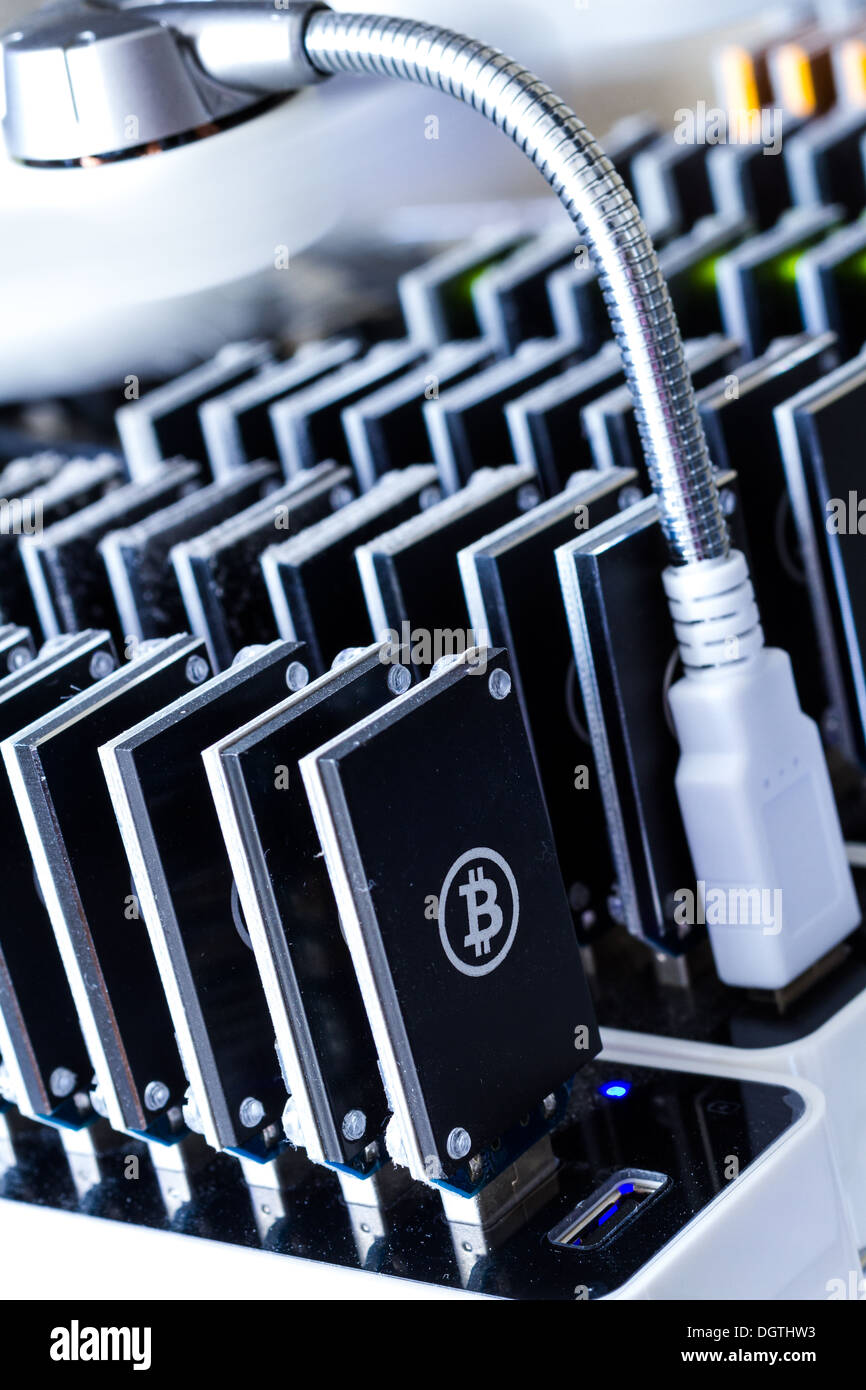 Bitcoin mining USB devices in a row with small fans Stock Photo - Alamy
