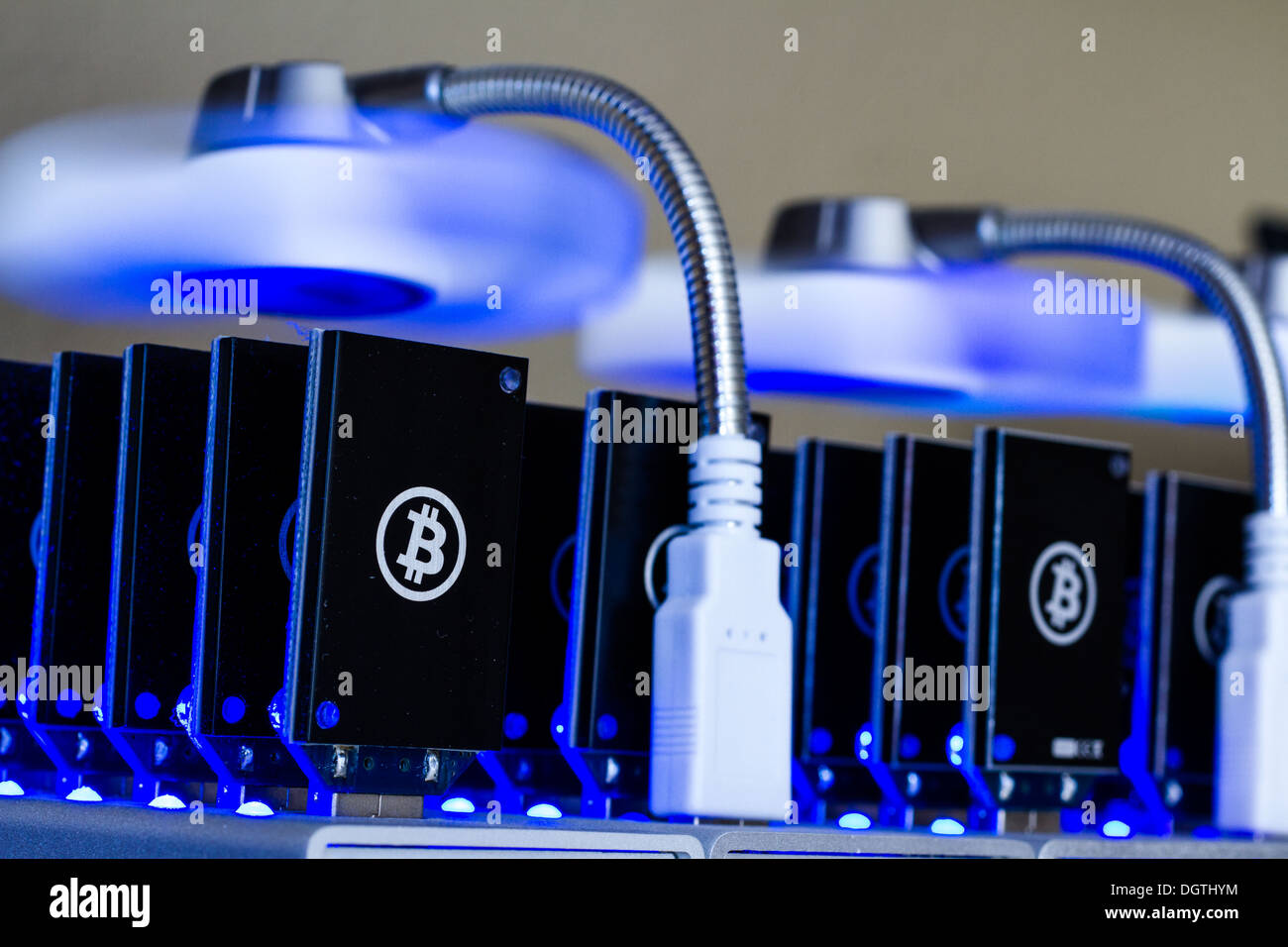 Bitcoin mining USB devices in a row with small fans Stock Photo - Alamy