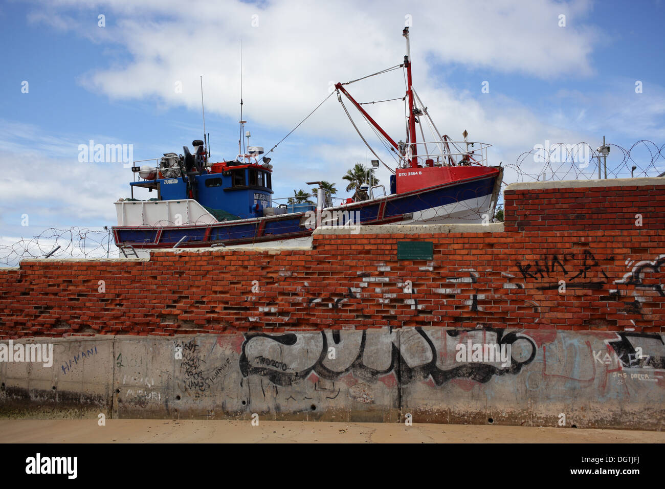 Fishing boat docked at harbor Stock Photo - Alamy