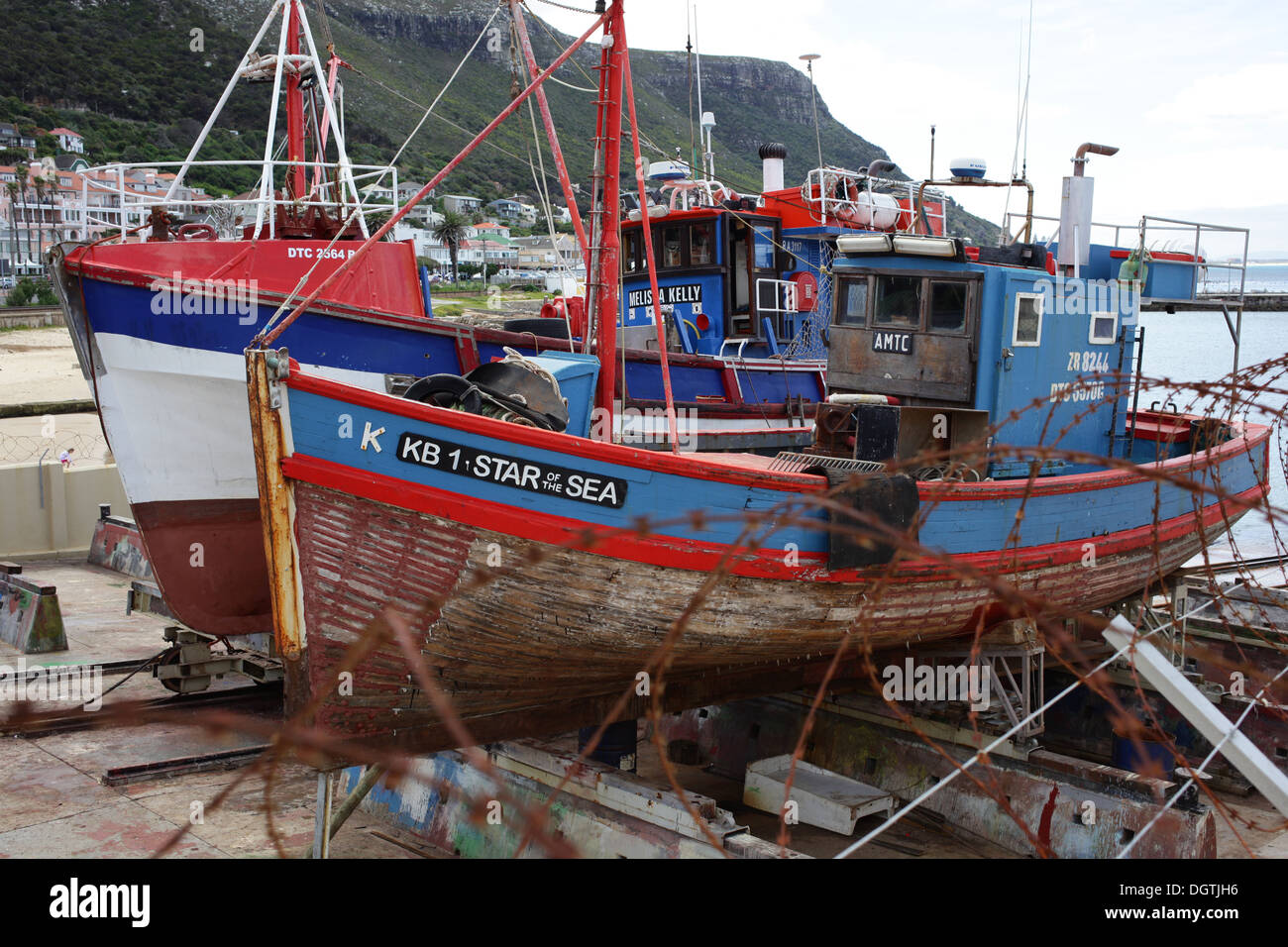 Small fishing boats in dry dock Stock Photo - Alamy