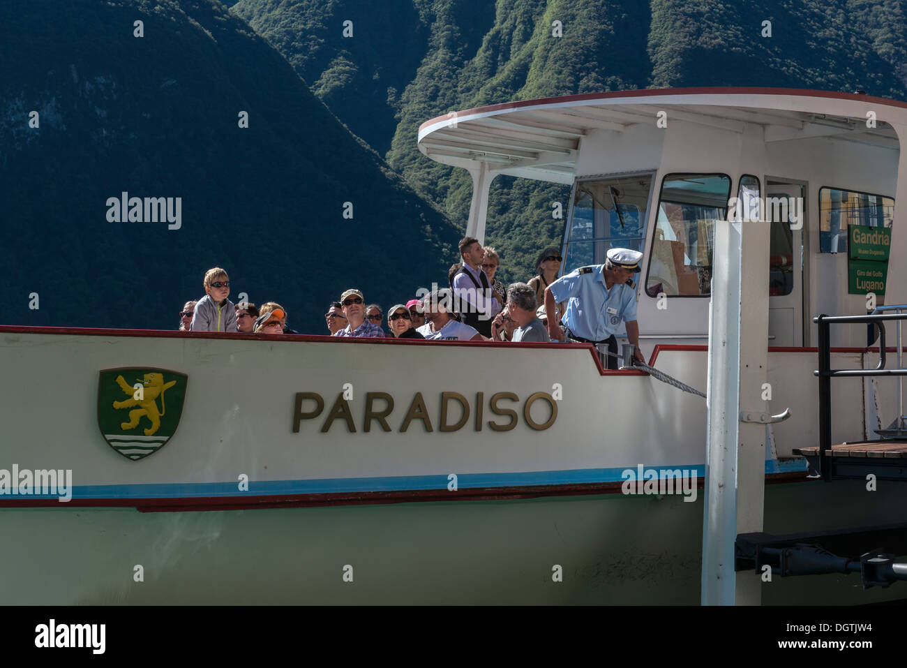 Passenger ferry boat arriving at the village of Gandria, Lake Lugano ...