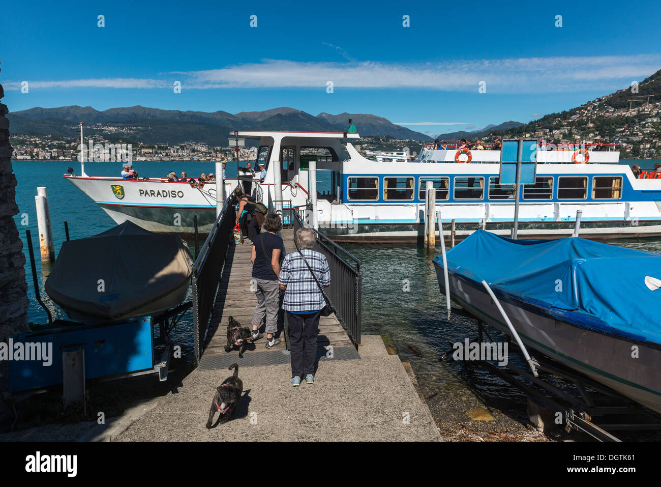 Passengers disembarking from the water ferry. Lake Lugano. Ticino ...