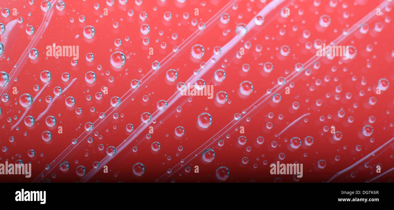 water drops on red background Stock Photo - Alamy