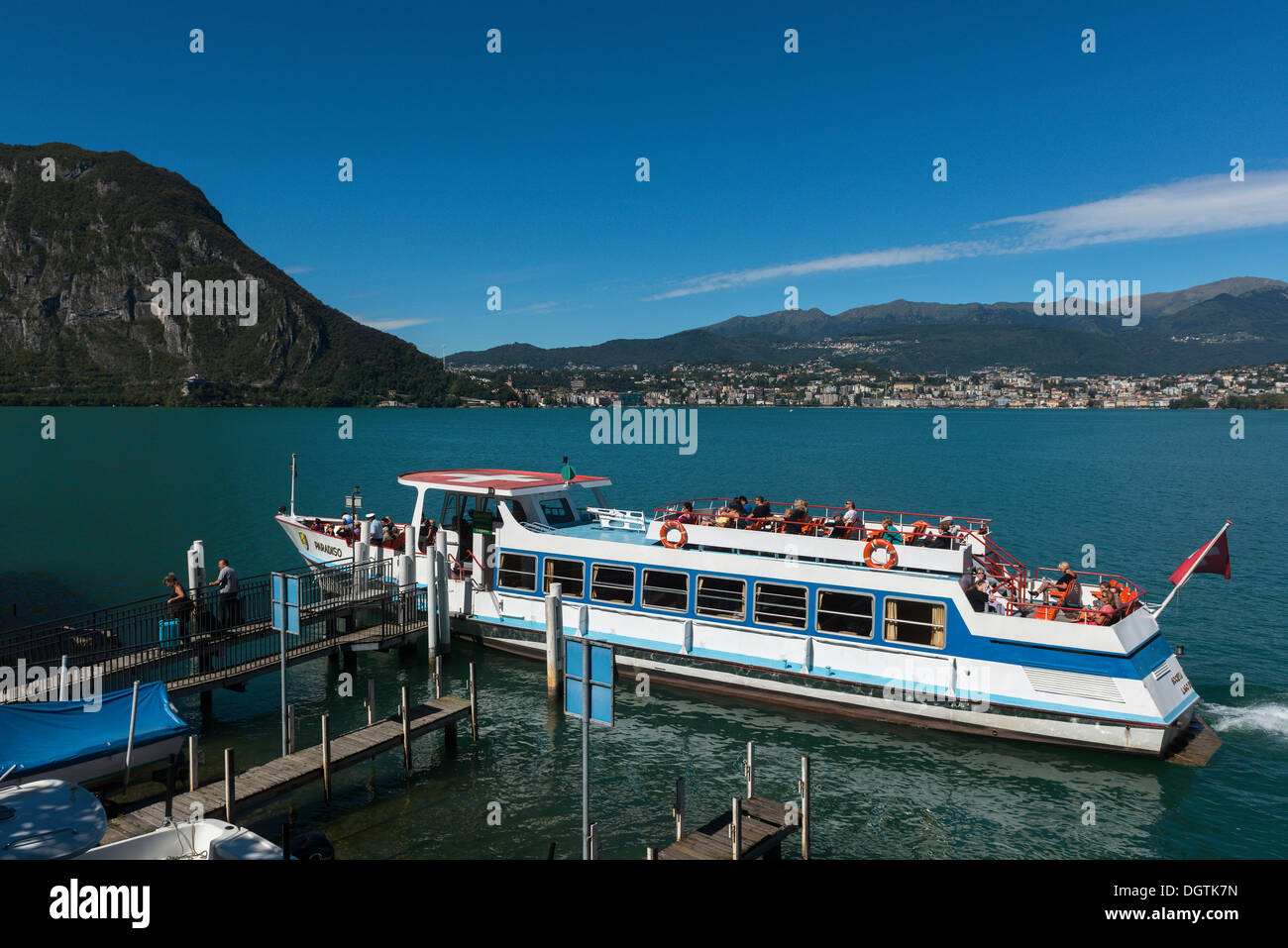 Passenger ferry boat arriving at Caprino jetty, Lake Lugano, Ticino ...