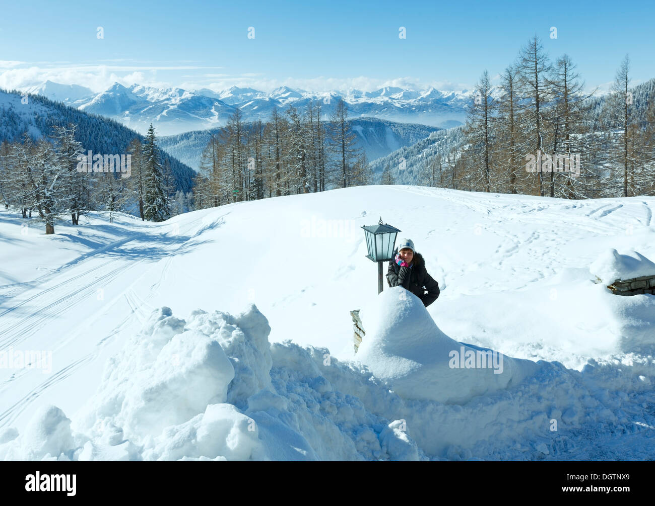 Winter hazy view from Dachstein mountain massif (Austria) and woman ...