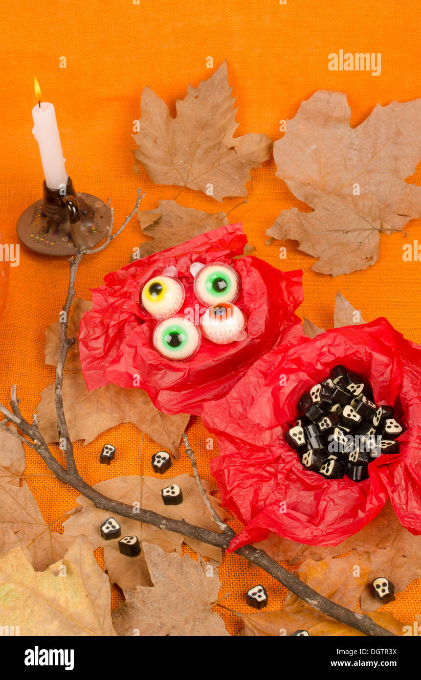 Halloween party treats for kids, candy in spooky shapes Stock Photo - Alamy