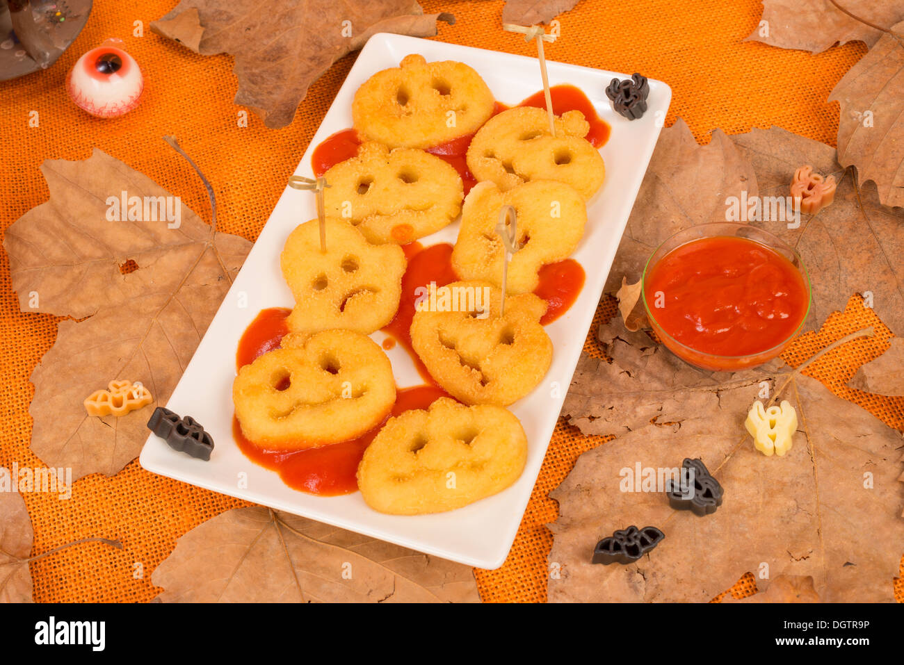 Halloween kid party snack, crunchy potato appetizer in spooky shapes ...