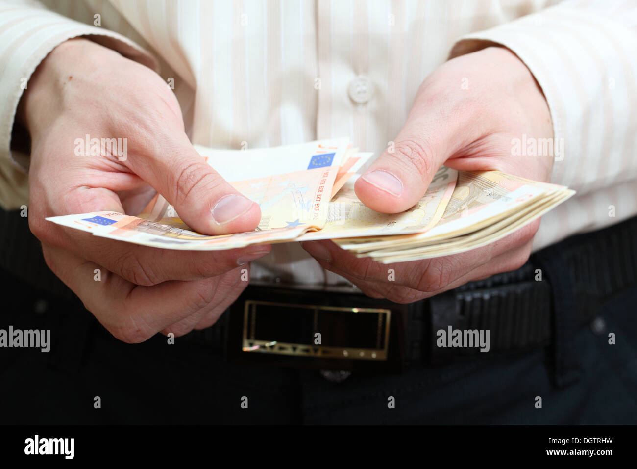 man hands holding euro money Stock Photo - Alamy