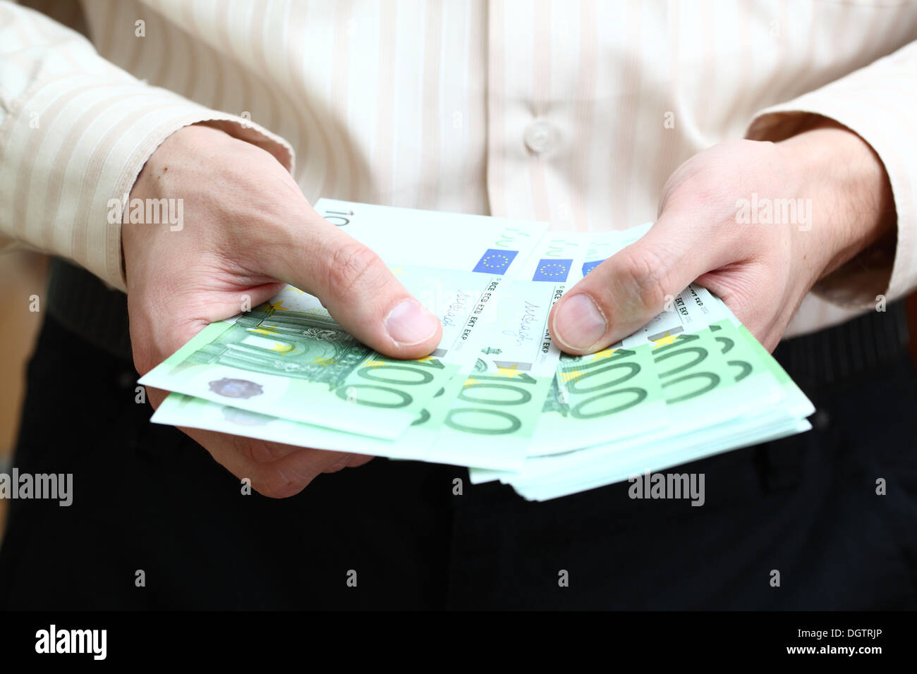 man hands holding euro money Stock Photo - Alamy