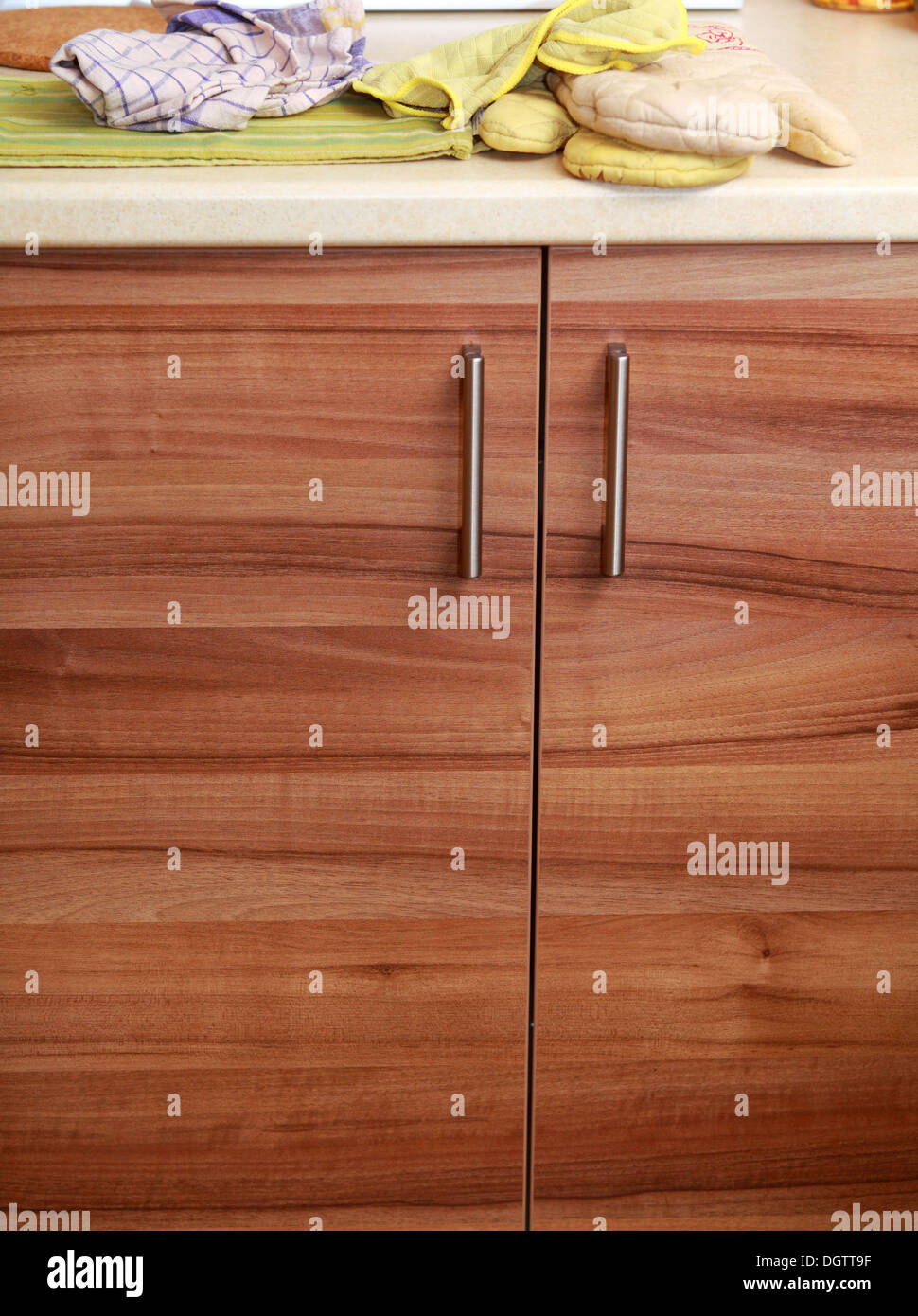 Close-up cupboard wood door cabinet in kitchen and top Stock Photo - Alamy
