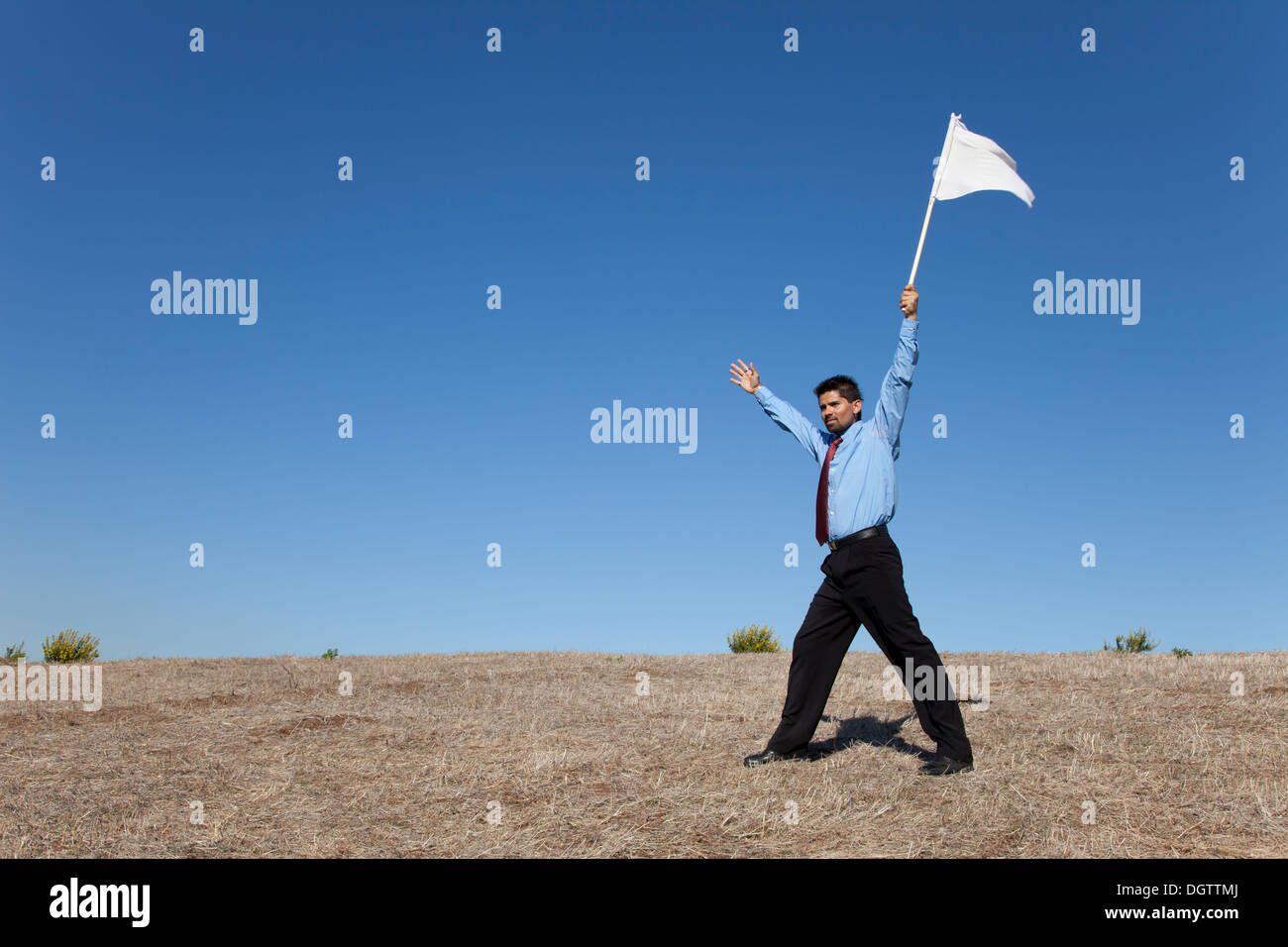 businessman asking for surrendering holding a white flag Stock Photo ...