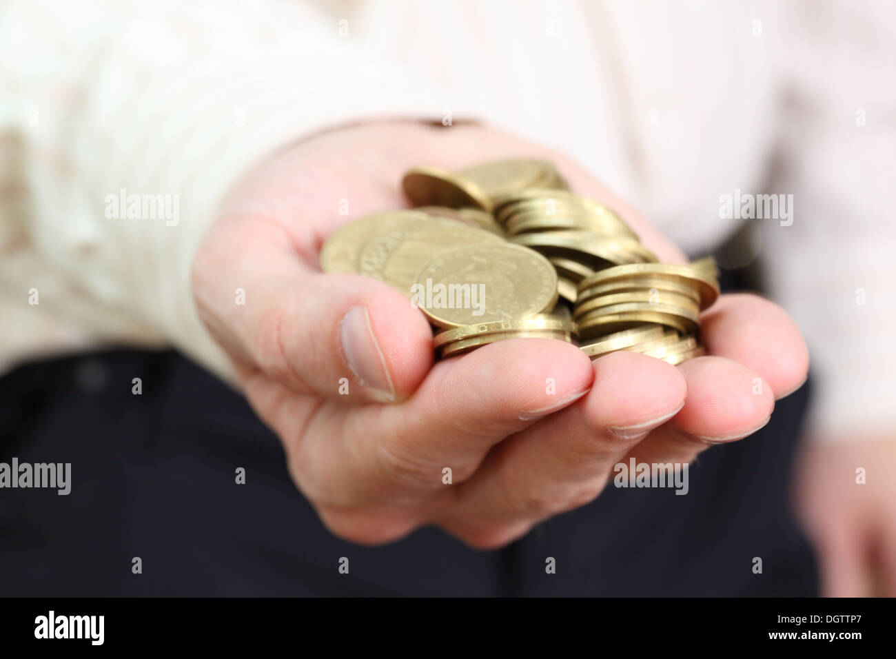 Hand holding pennies hi-res stock photography and images - Alamy