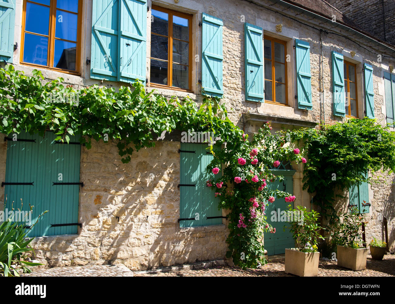 Typical French house with roses and blue shutters Stock Photo - Alamy