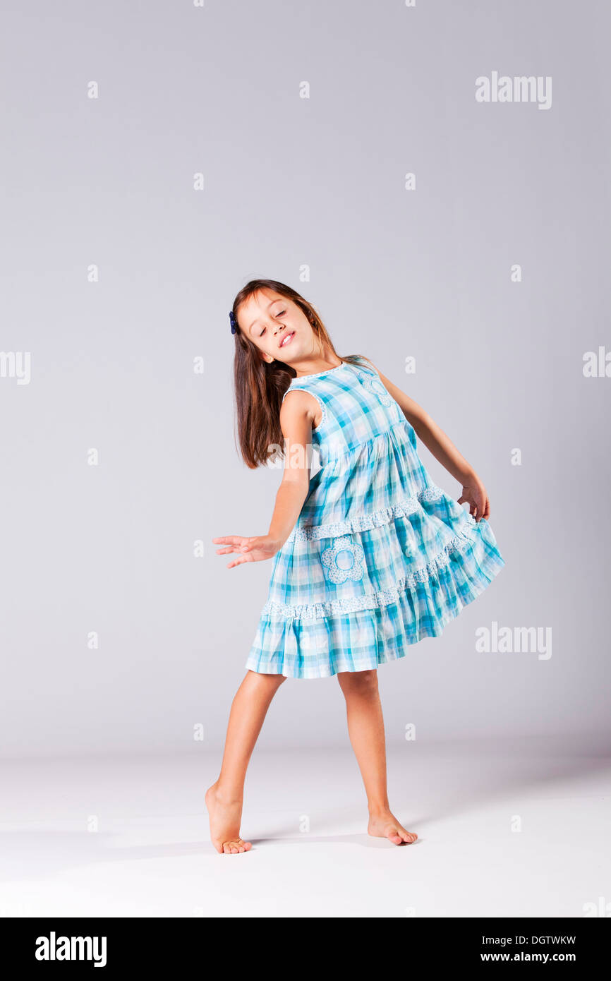 Little happy girl dancing like a ballerina Stock Photo - Alamy